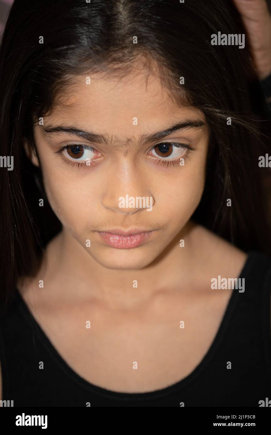 School age Indian girl posing, looking at the camera Stock Photo - Alamy
