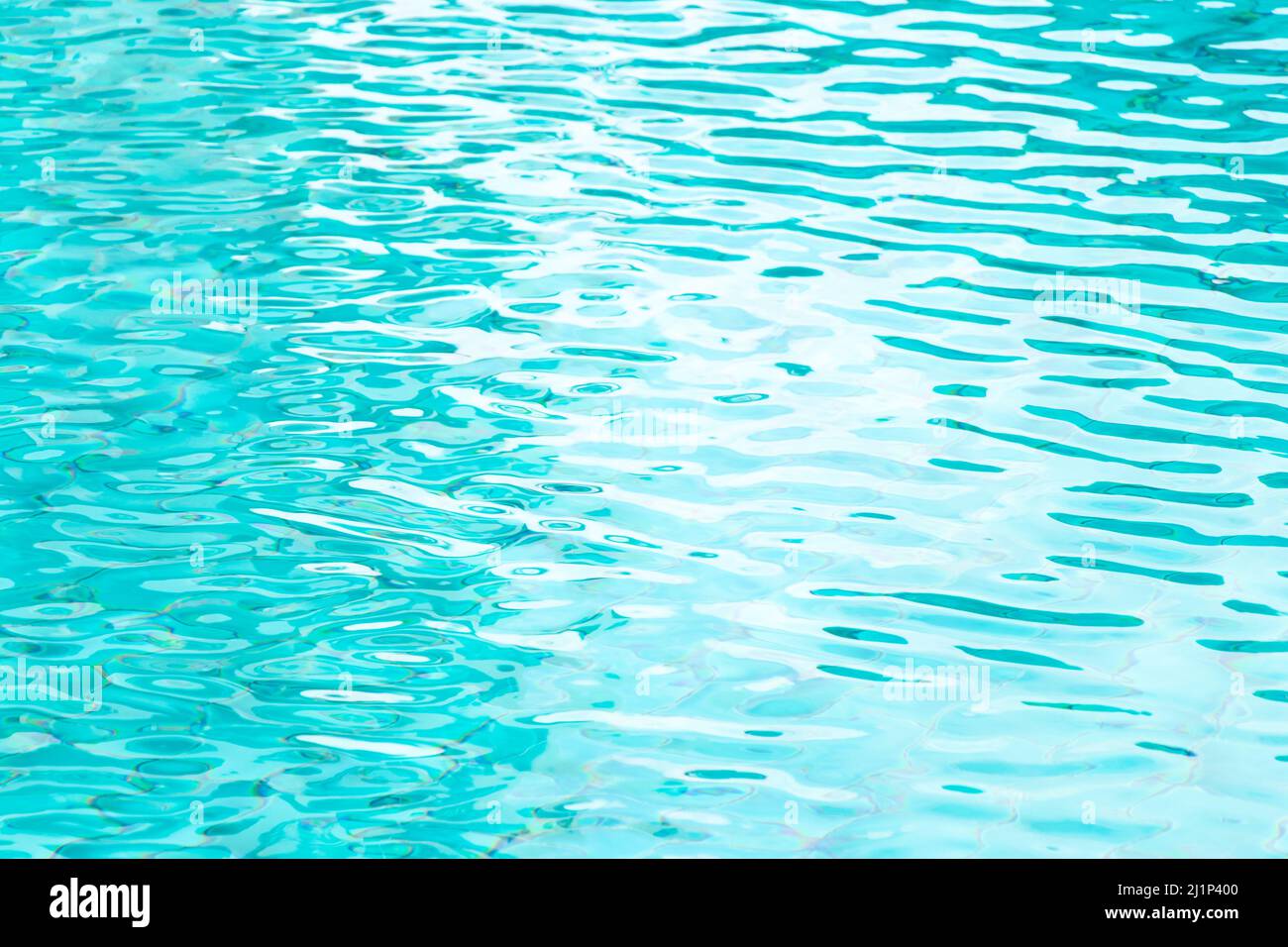 Ripple Water in swimming pool with blue tile floor background Stock ...