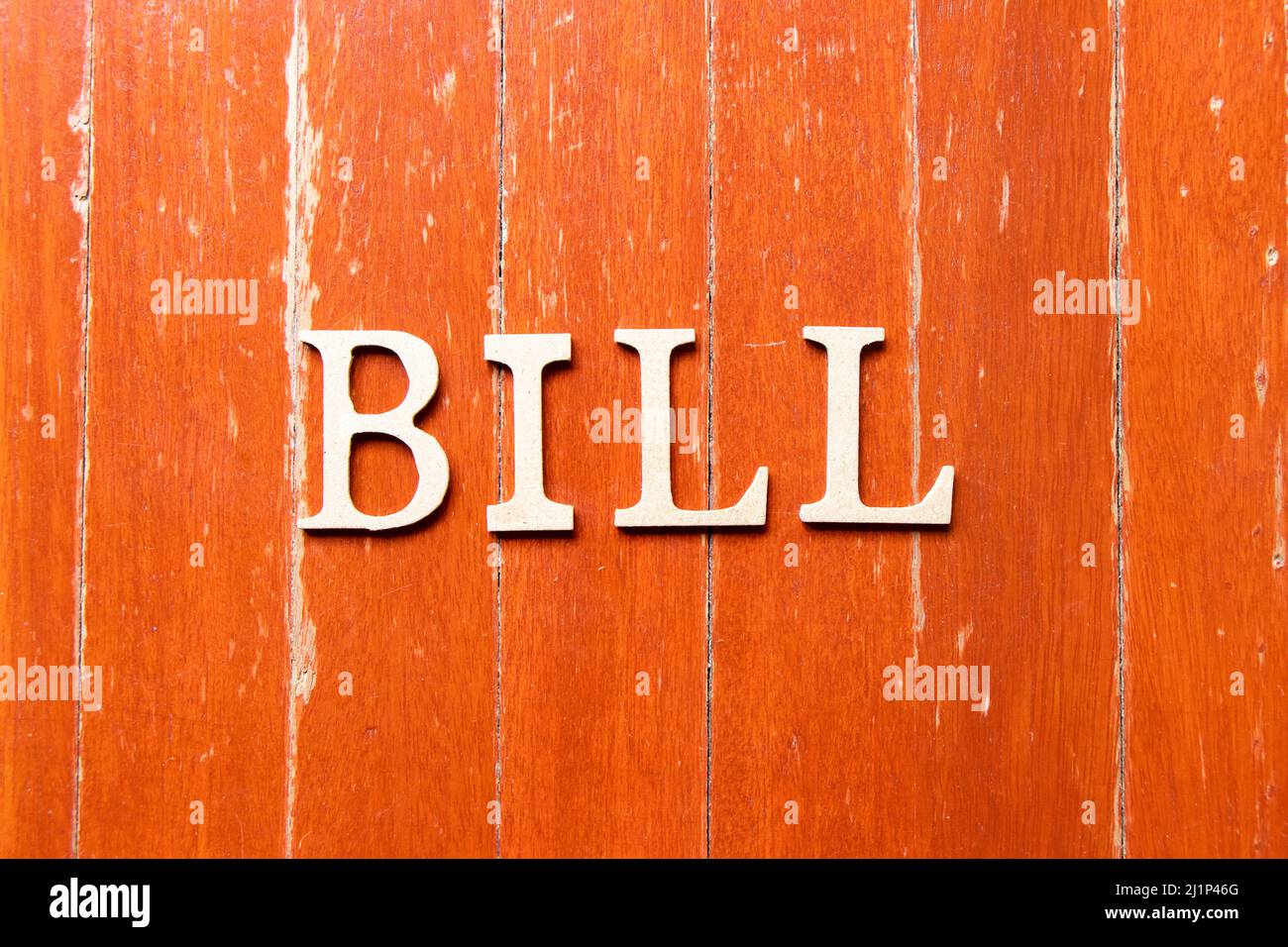Alphabet letter in word bill on old red color wood plate background ...