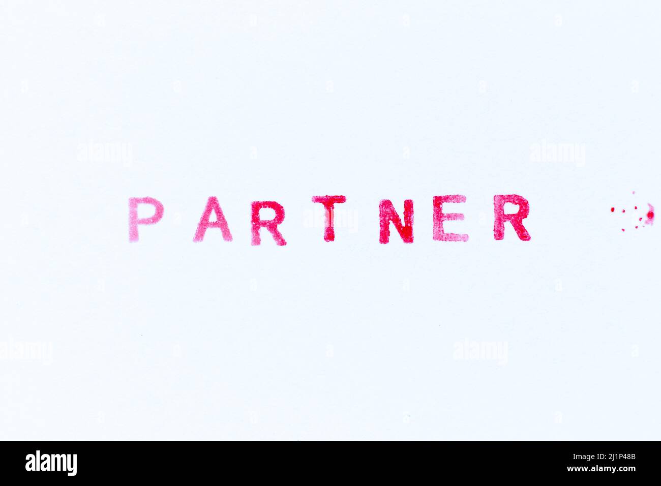 Red color ink rubber stamp in word partner on white paper background ...