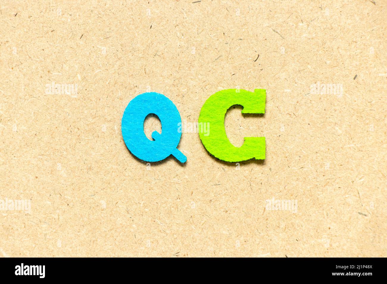 Color cloth alphabet letter in word QC (Abbreviation of Quality Control ...