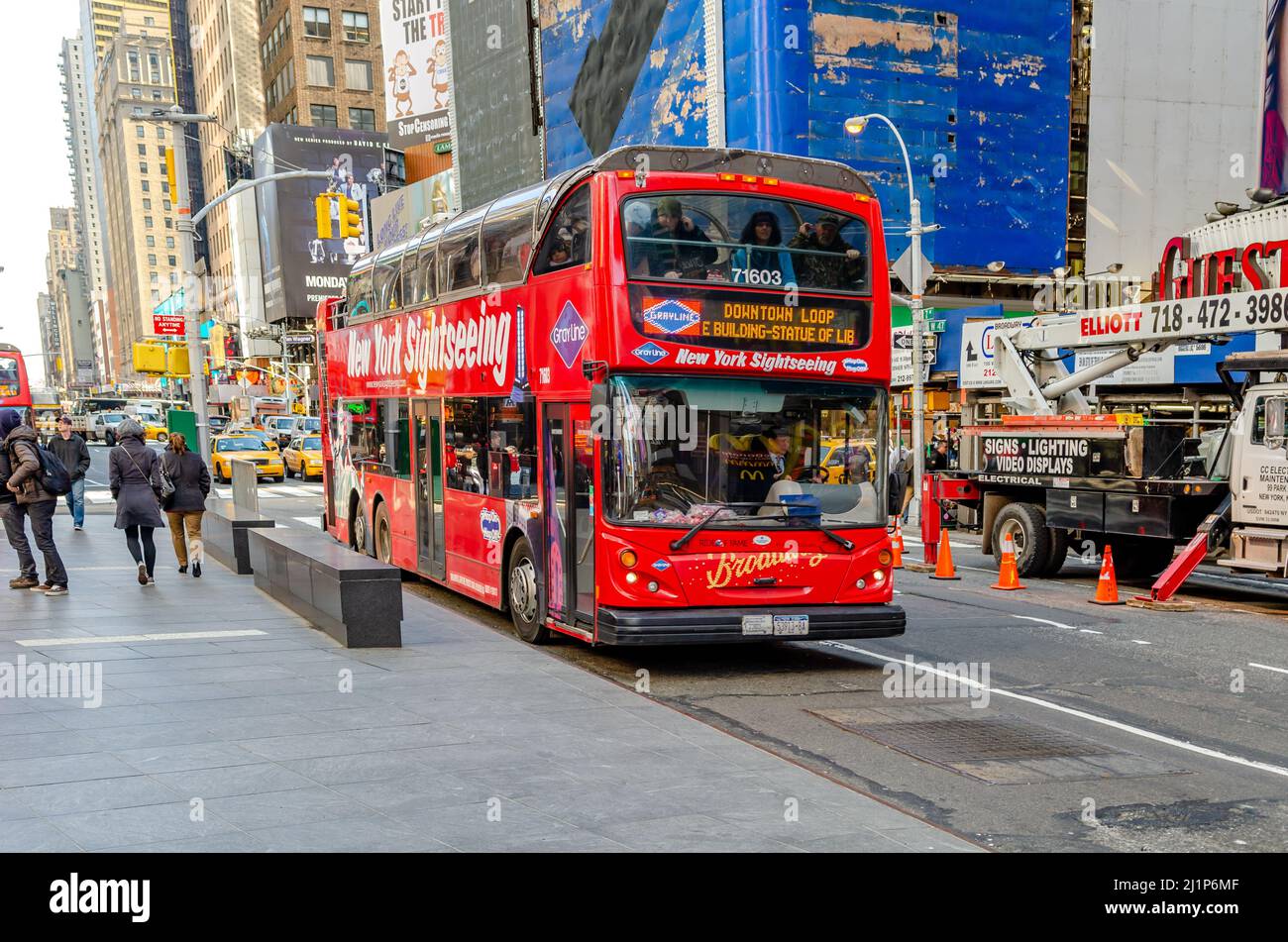 Red New York Sightseeing Bus parked at Time Square, lots of Tourist ...