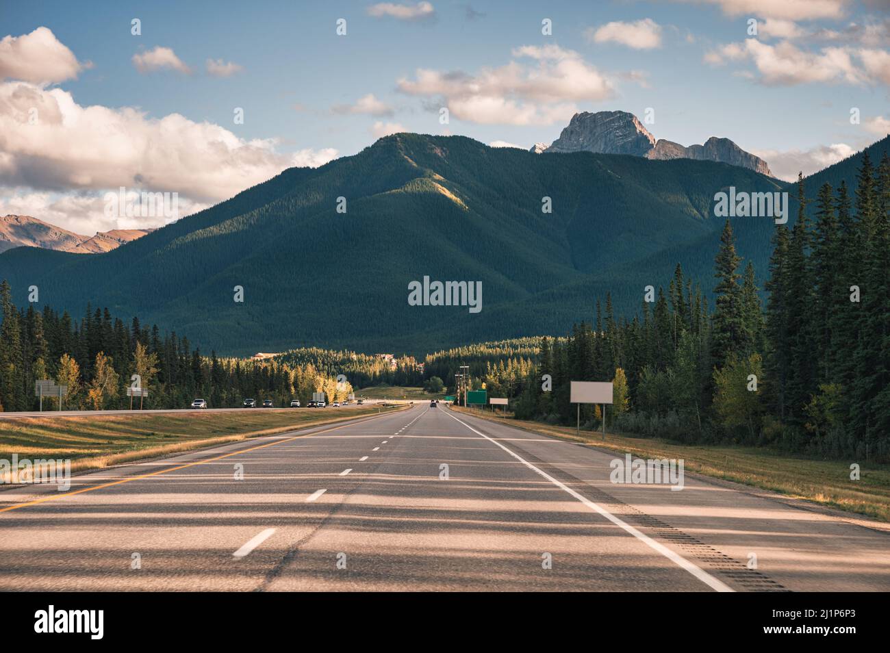 Road trip with car driving with rocky mountains on highway in Banff ...