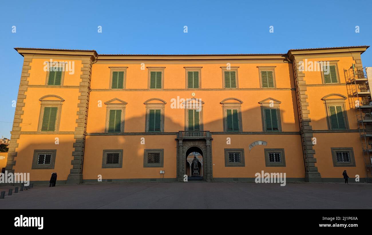 The bright sun lighting up an old building under a clear sky Stock ...