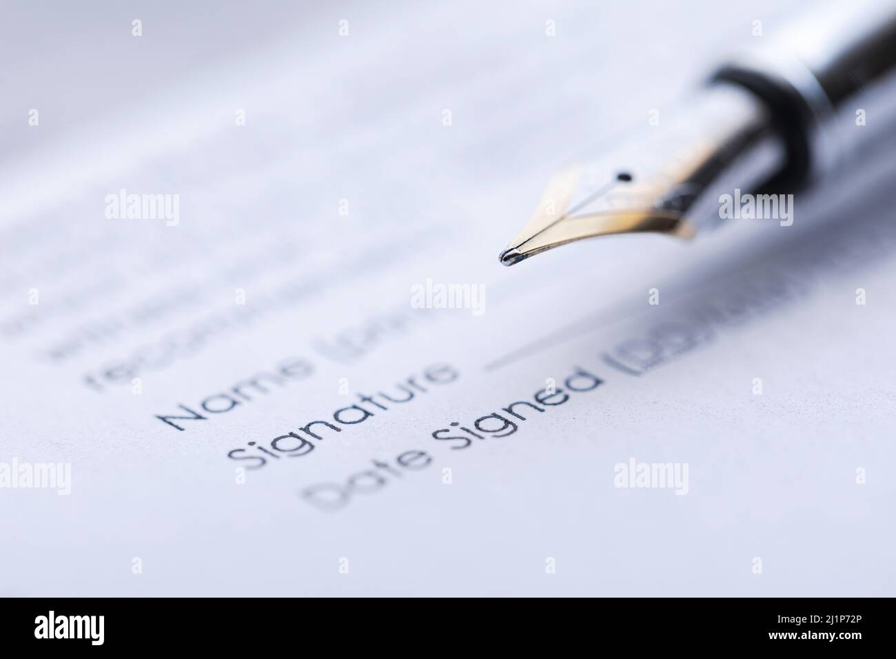 Signing the business contract. Fountain pen and document Stock Photo ...