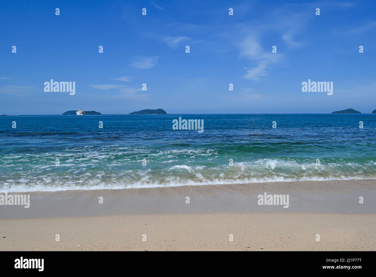 Ocean splashing waves with sandy beach at Borneo, Malaysia Stock Photo ...