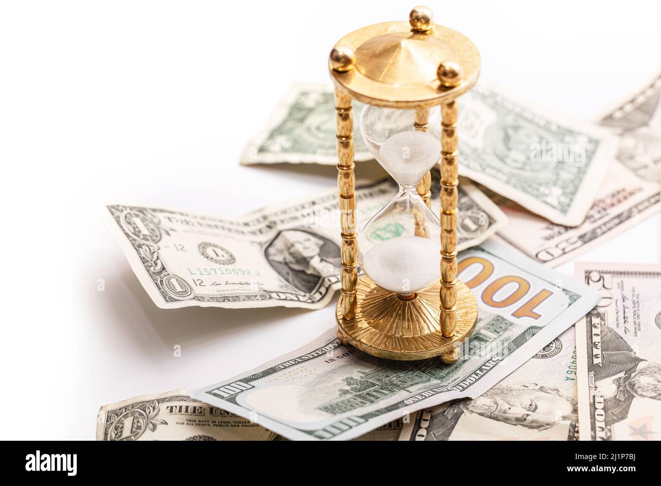 Hourglass and US dollar banknotes. Concept of investment and inflation ...