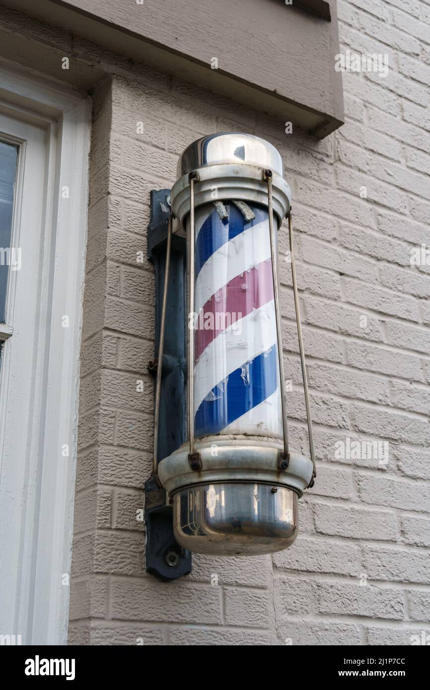 An antique barber shop pole on the outside of a building in Lexington ...