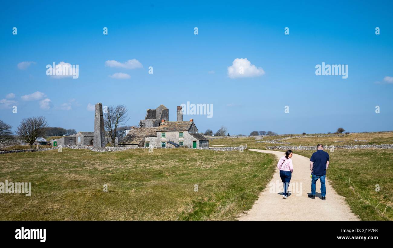 A couple walks up the path to visit the ruined Magpie Mine, an old lead ...