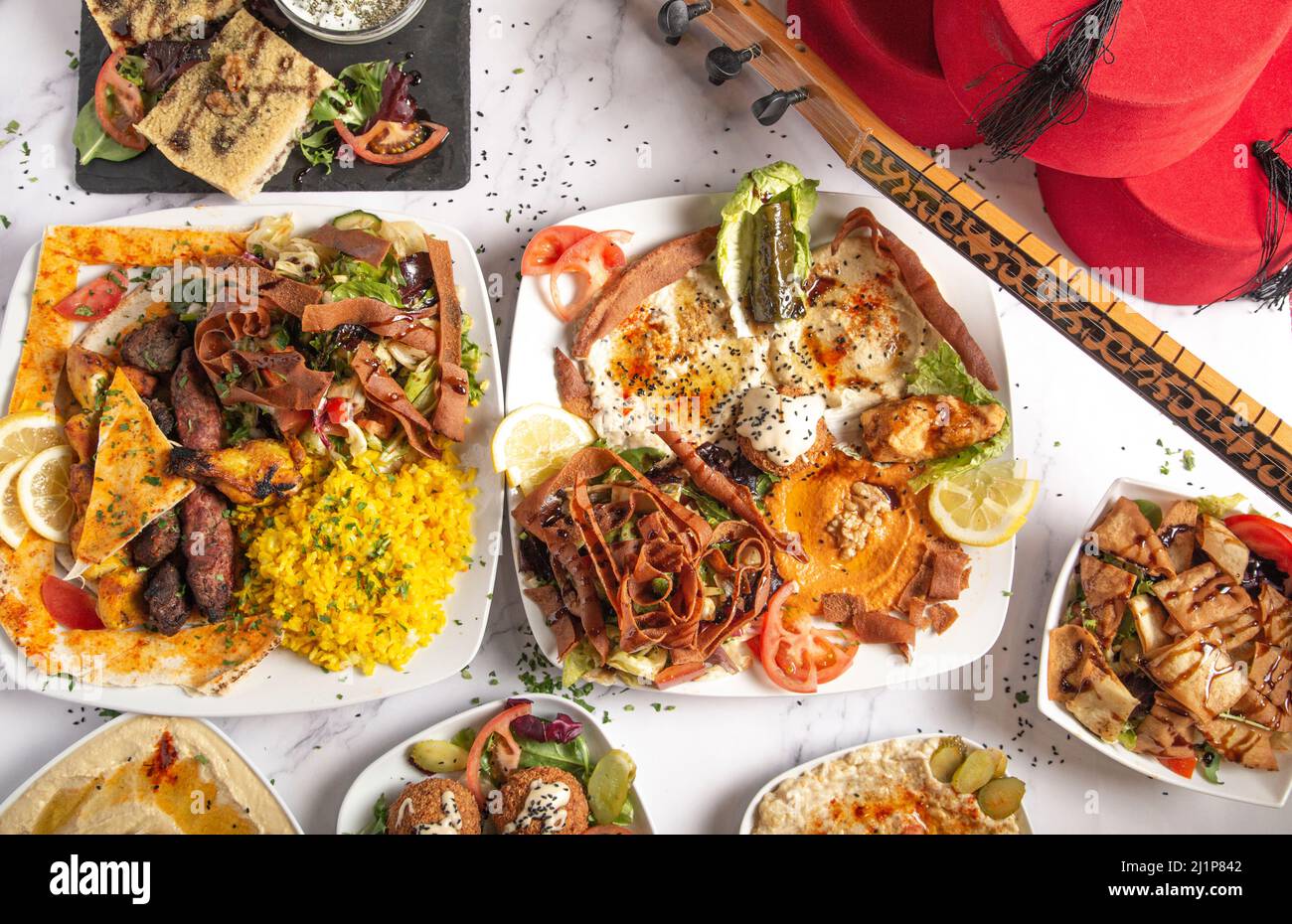 Top view of a variety of Middle Eastern and Arabic food dishes on a ...