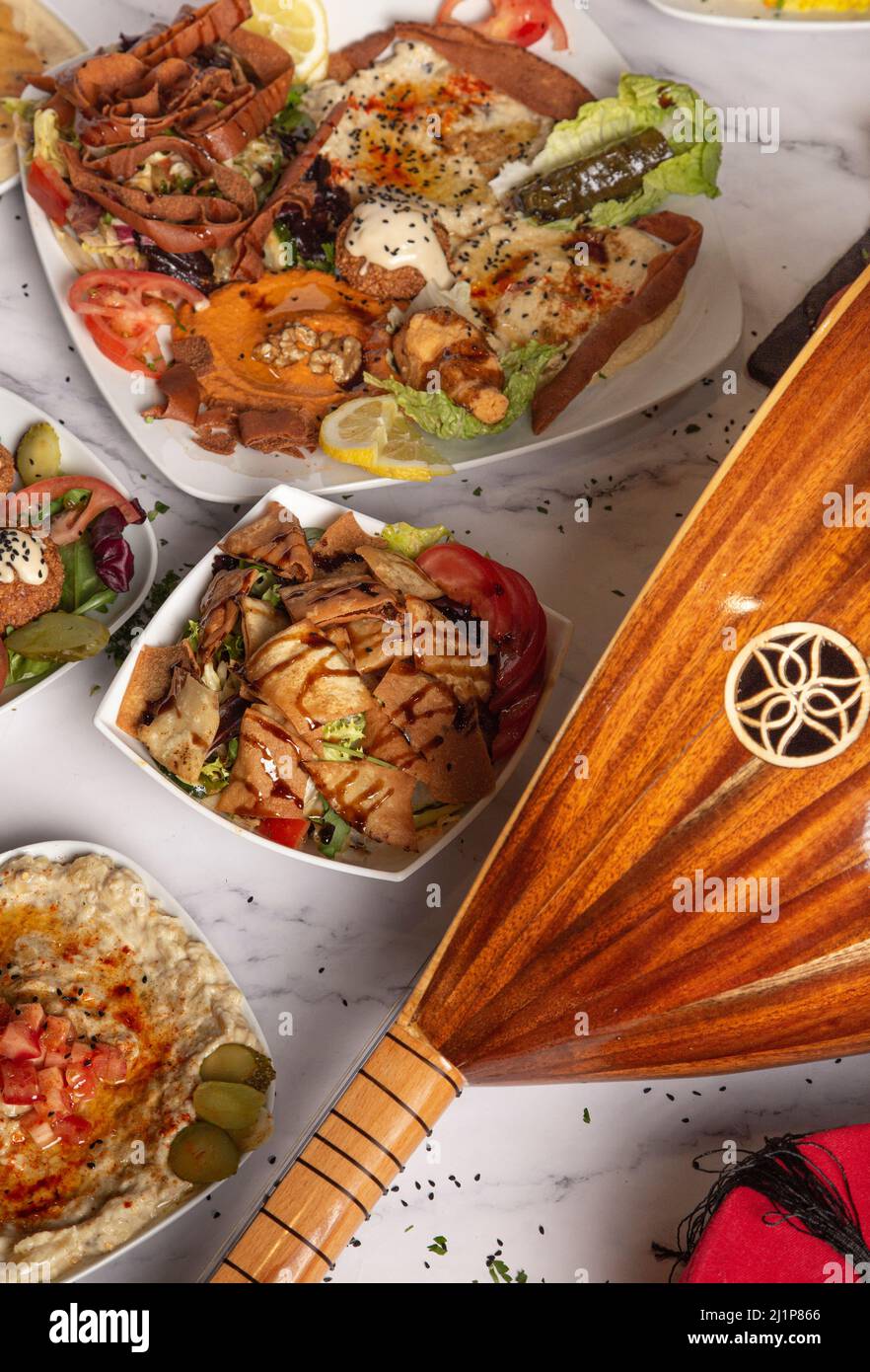 Close up of variety of middle eastern food dishes with arabic props ...
