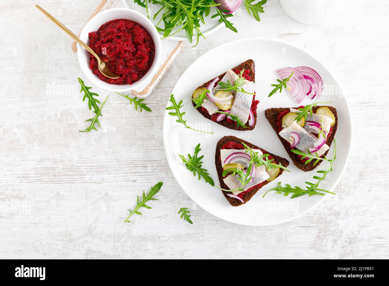 Sandwiches with salted herring fillet and beetroot pate. Top view ...