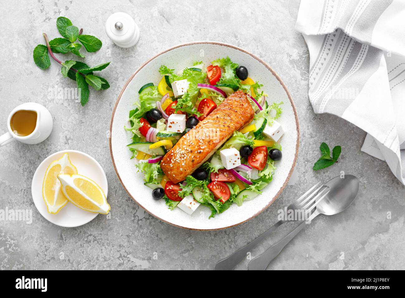 Salmon fish salad. Fresh vegetable greek salad with tomato, pepper ...