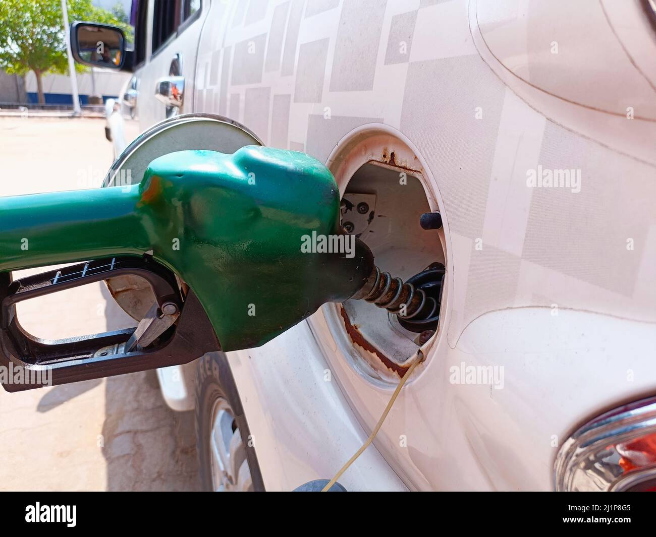 Car filling diesel fuel at gas station in India Stock Photo - Alamy