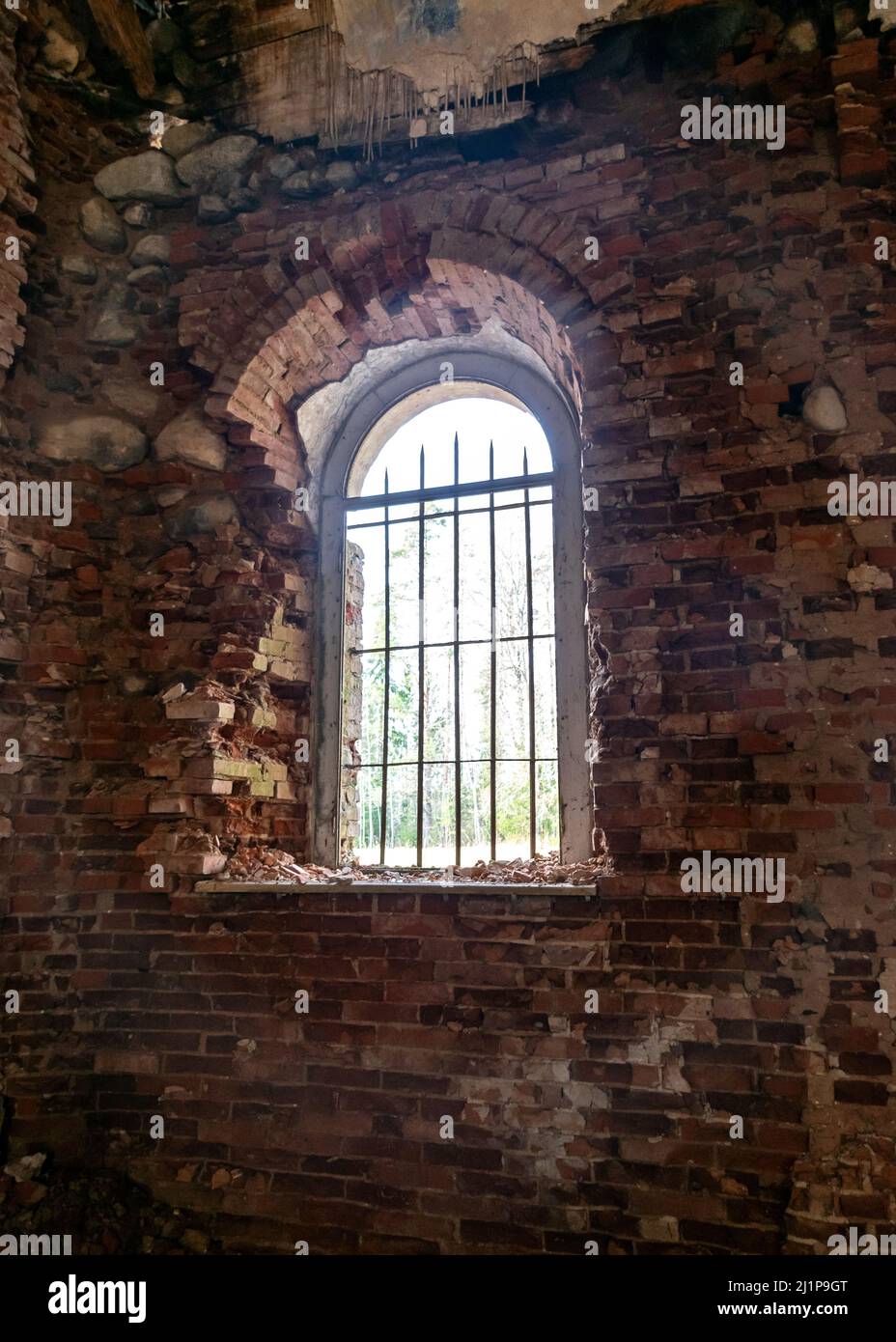 photo with old arched windows in an abandoned church, iron grilles in ...