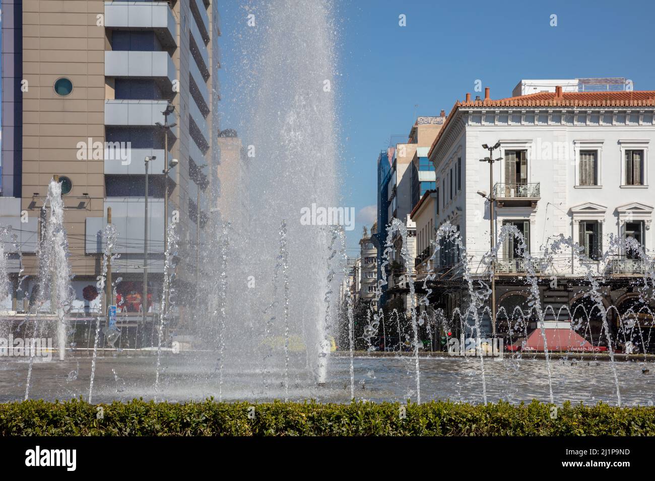 Water fountain in Omonoia Square, Athens, Greece. sunny day, blue sky ...