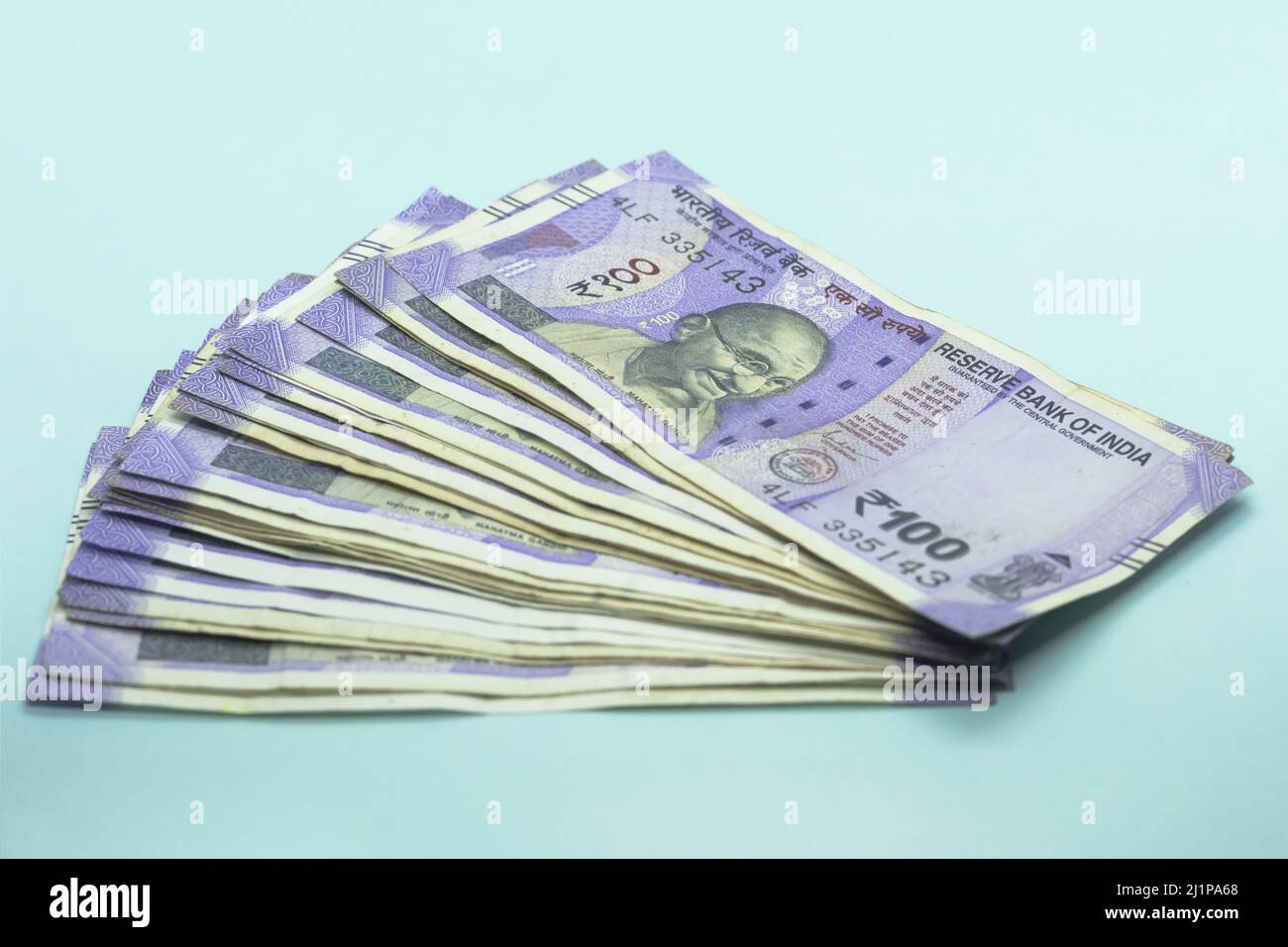 a photo of money on blue background Stock Photo - Alamy