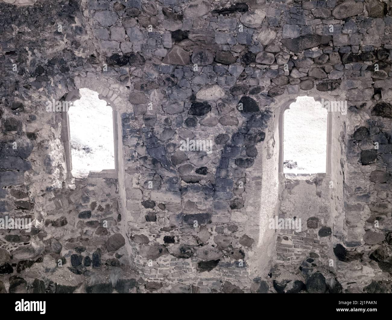 infrared surreal landscape, fragments of an old stone castle ruin in an ...