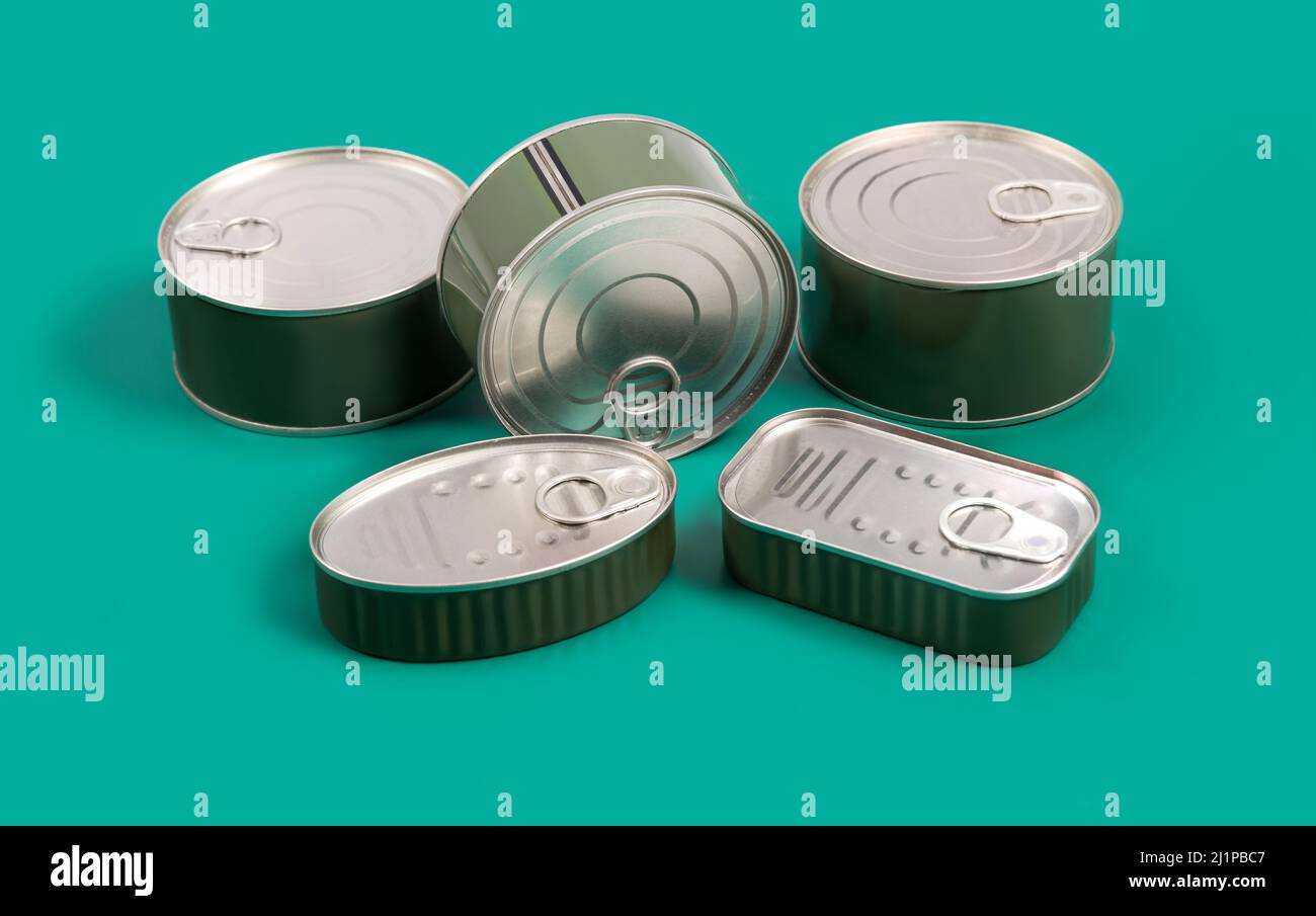 Unopened green cans with food inside on green background Stock Photo ...