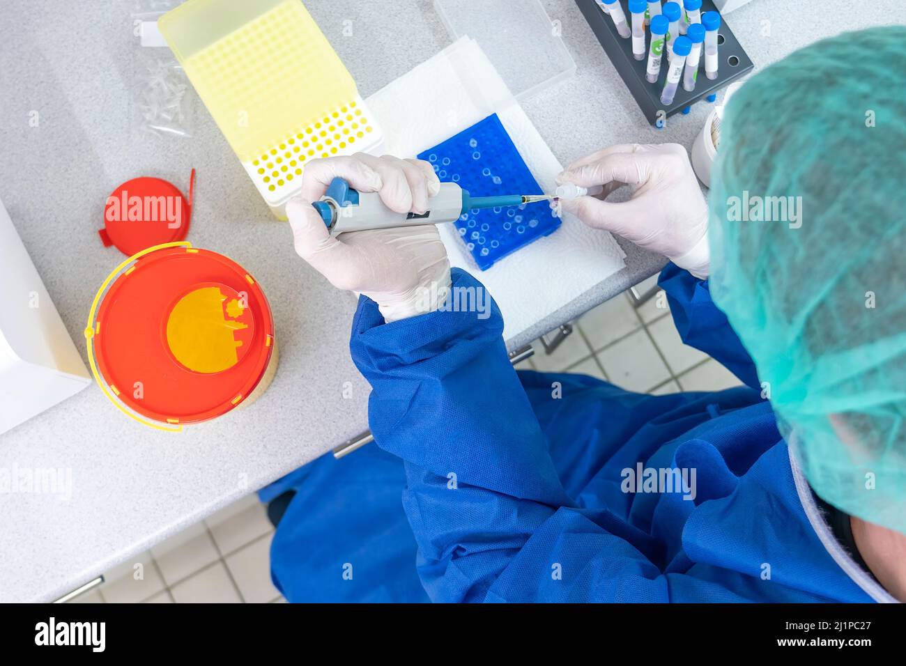 Medical lab scientists in laboratory using Air displacement micro ...