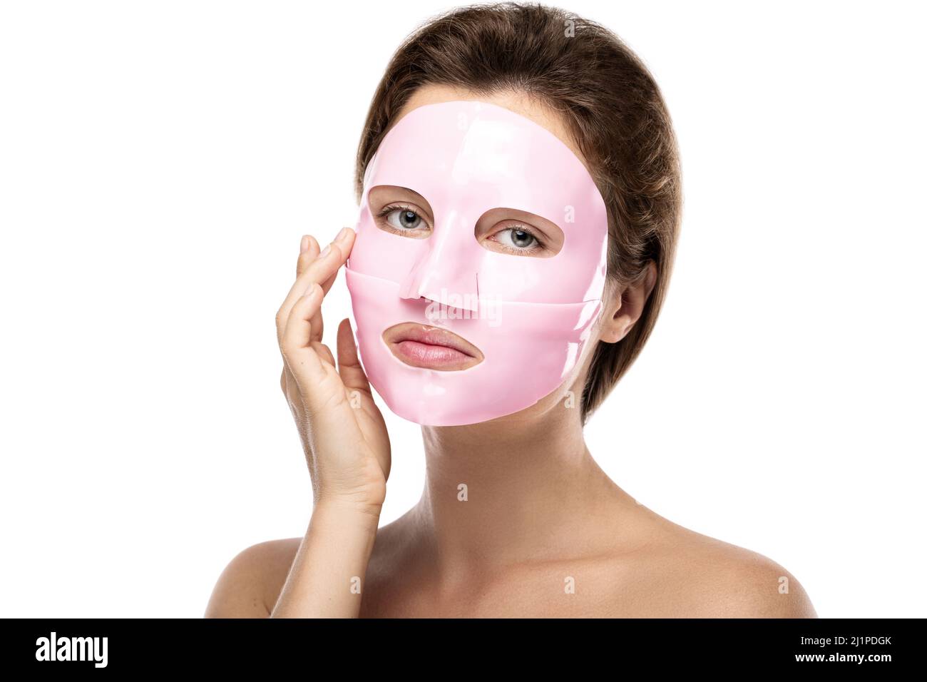 Young beautiful woman with rubber facial mask on her face Stock Photo ...