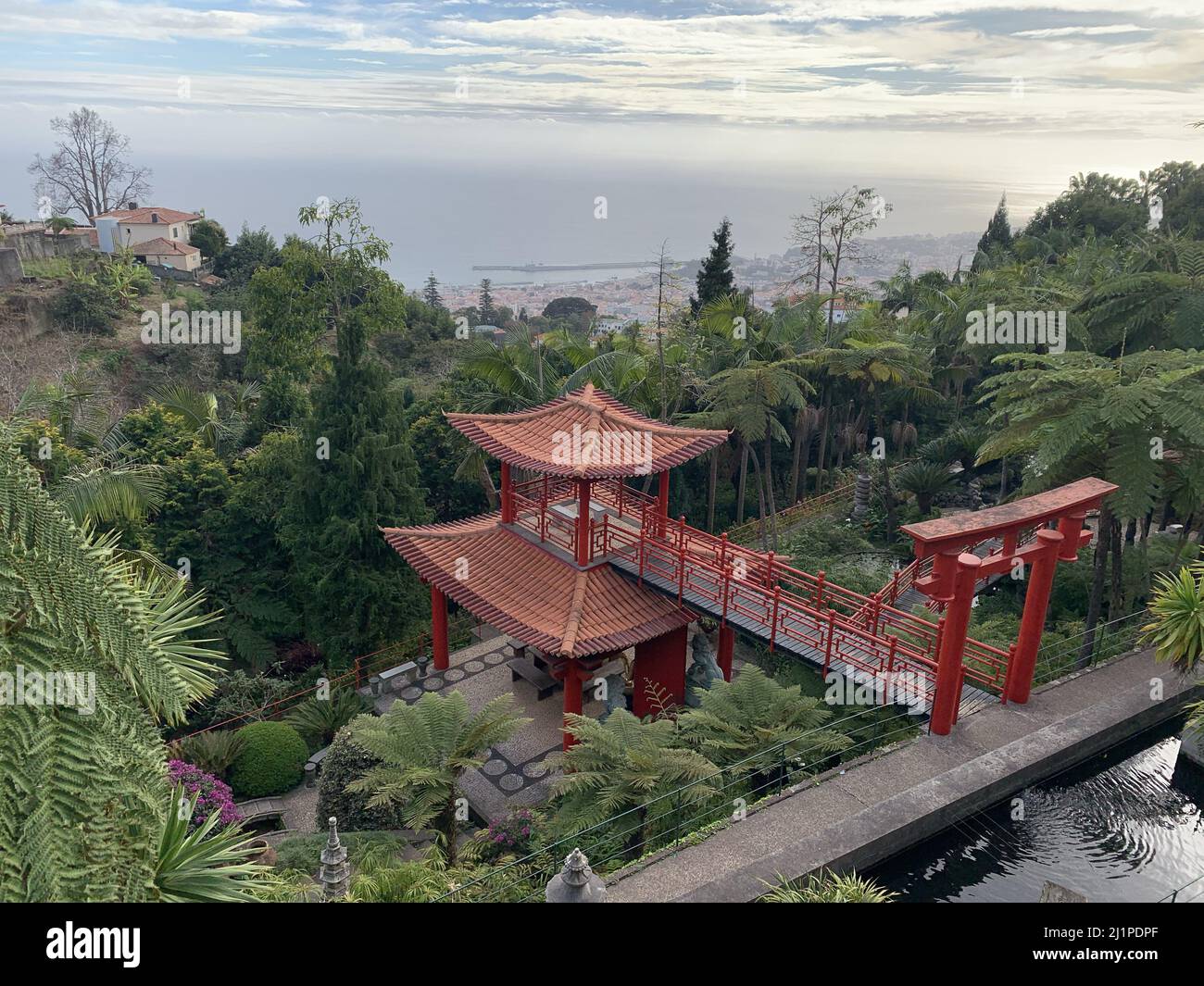 An aerial beautiful landscape view of a traditional red bridge in Monte ...