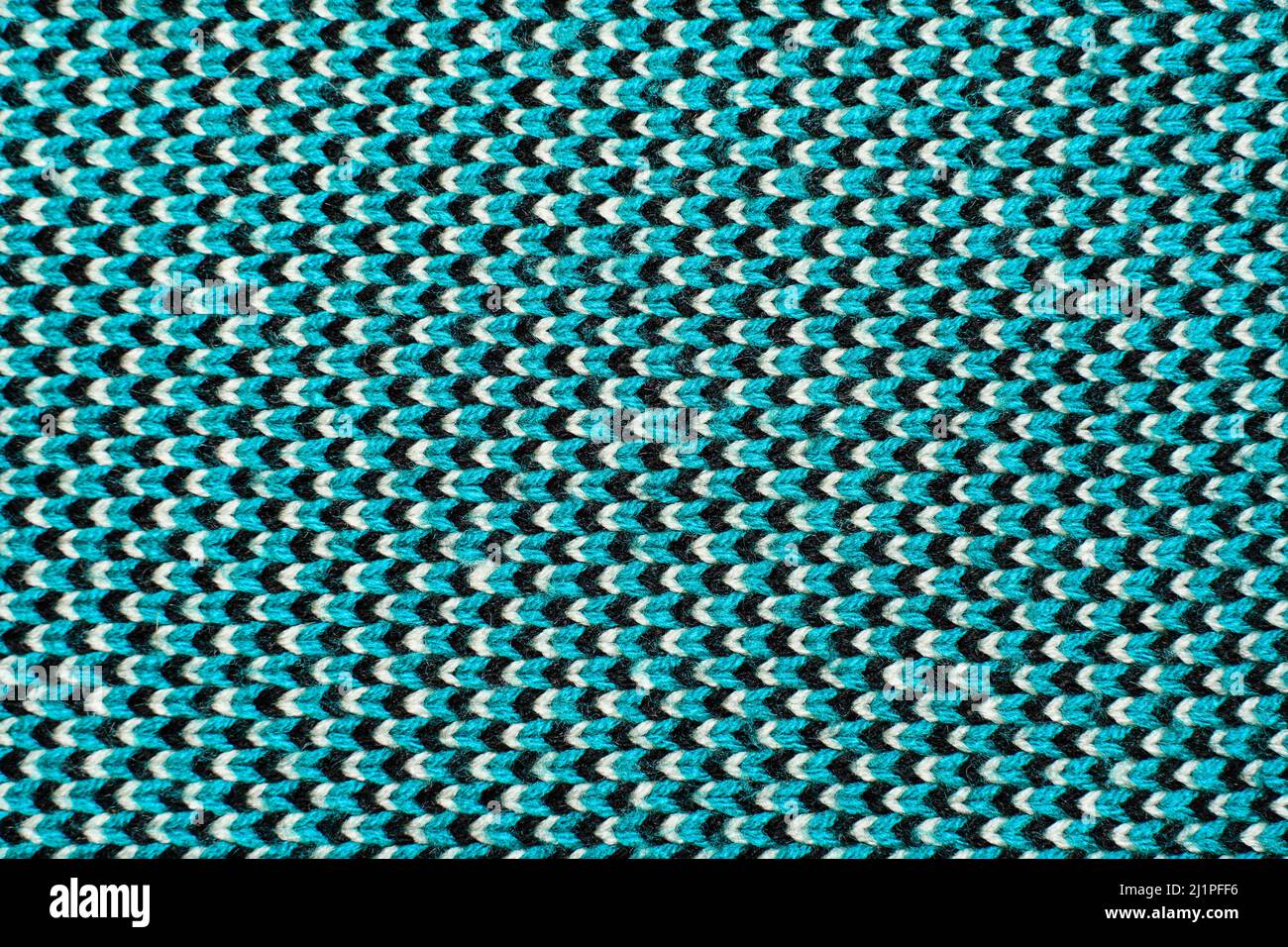 Synthetic knitted fabric with pattern elements of blue, black and white ...