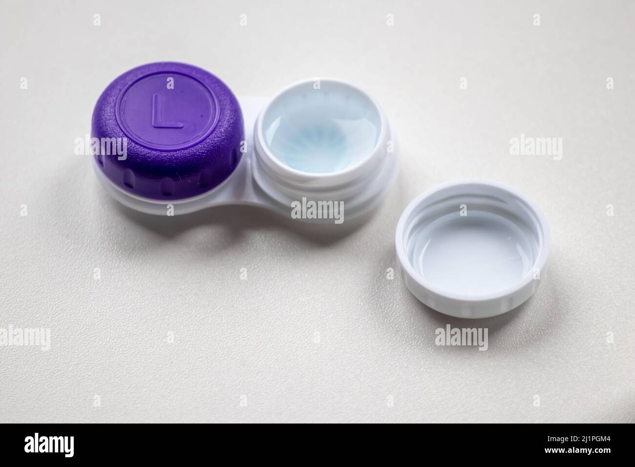 Contact lens container with contact lenses as optic alternative to ...