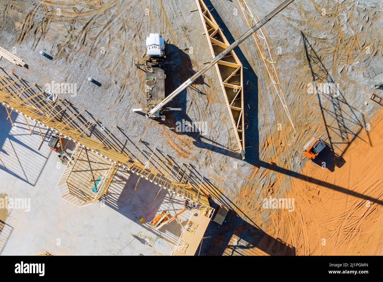Construction a crane holds timber frame house of residential building ...