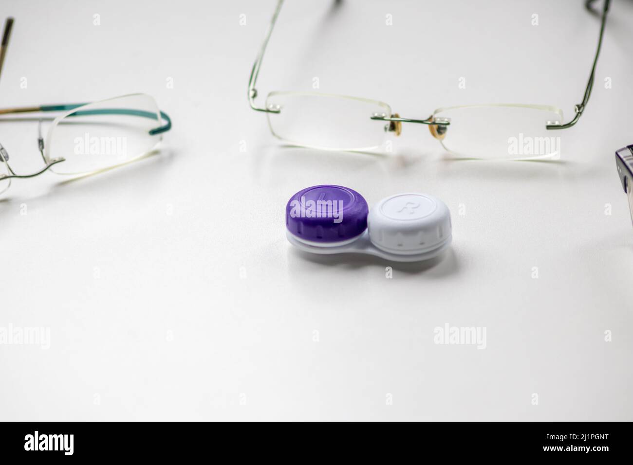 Contact lens container with contact lenses as optic alternative to ...