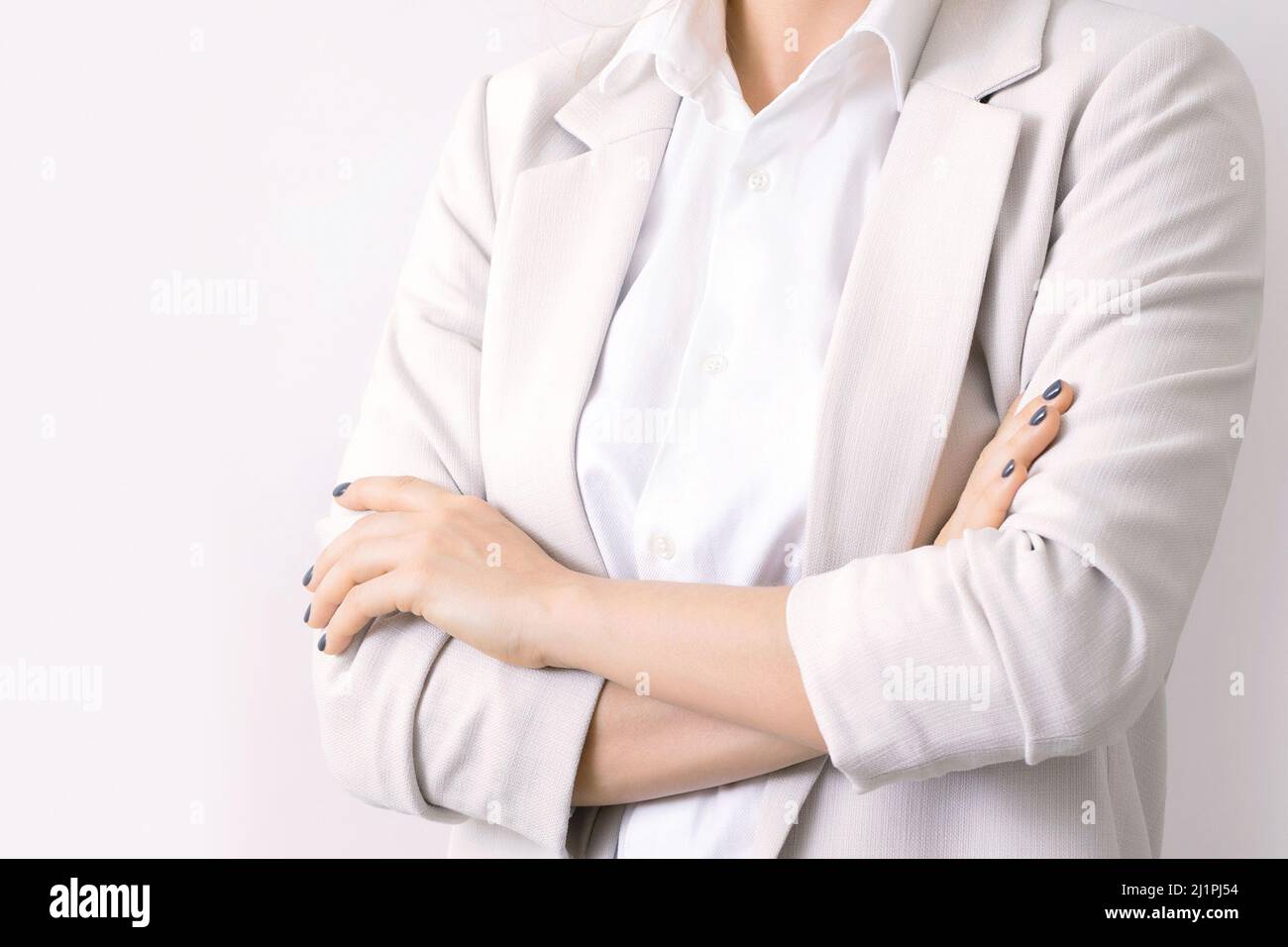 Close-up of female body with arms crossed Stock Photo - Alamy