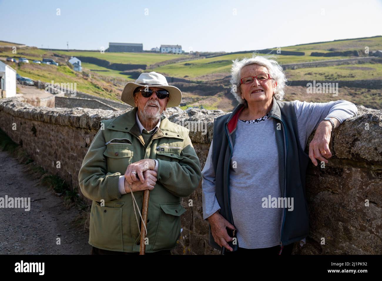 Two people pose for a photo in Cape Cornwall, Cornwall,UK Stock Photo ...