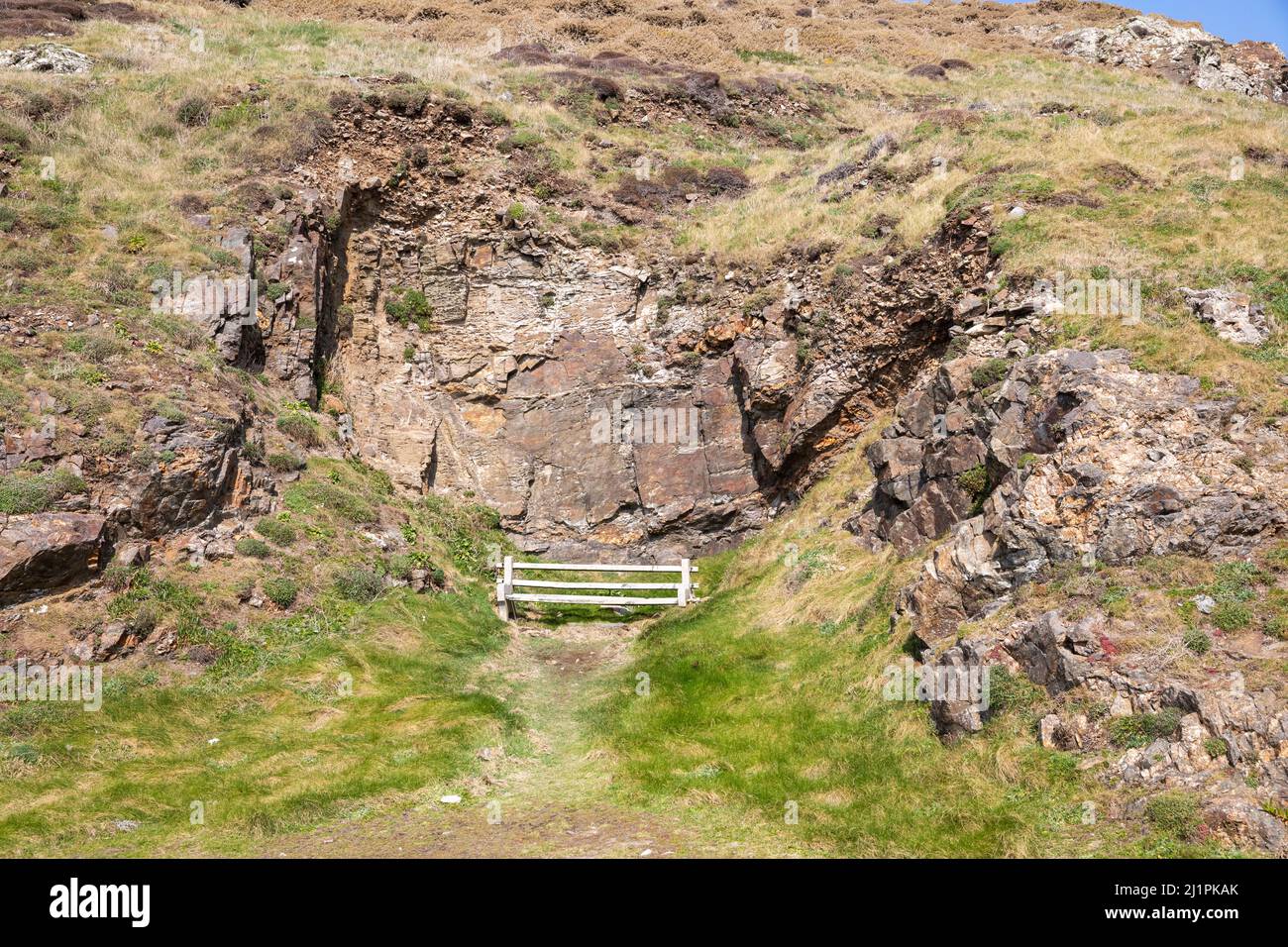 A bench under Rocks in Cape Cornwall, Cornwall,UK Stock Photo - Alamy
