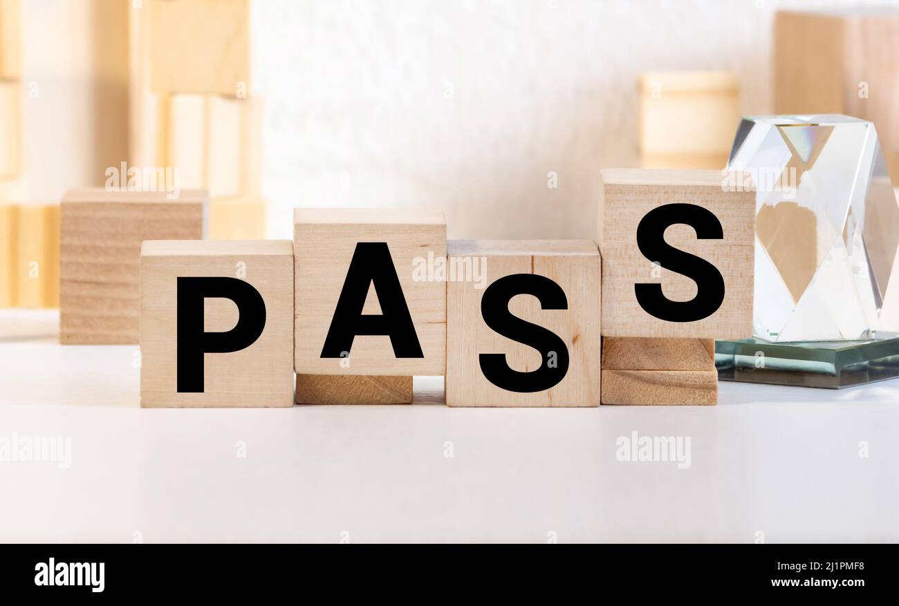Letter block in word pass on wood background Stock Photo - Alamy