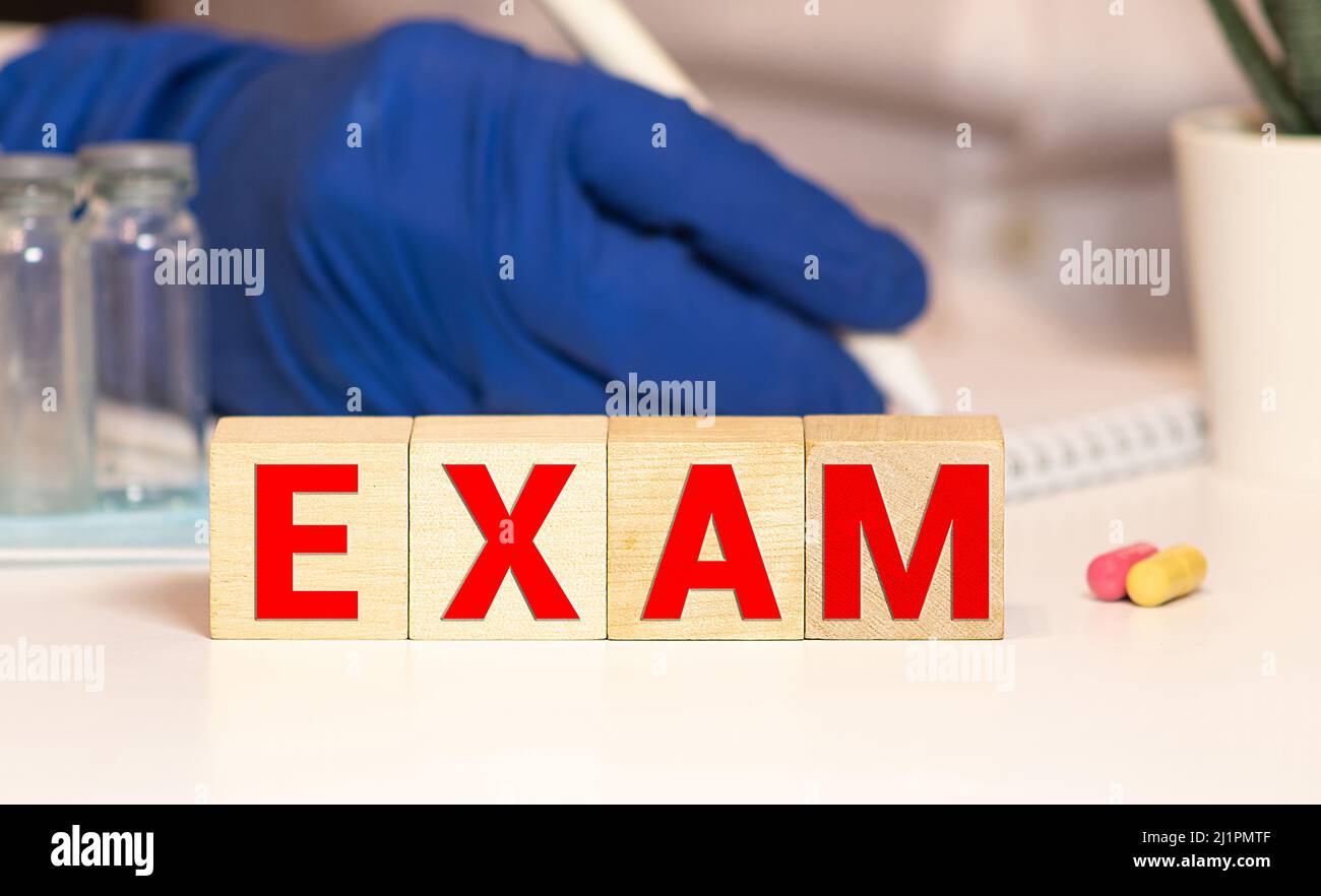 Exam word made by letter blocks, medical concept Stock Photo - Alamy