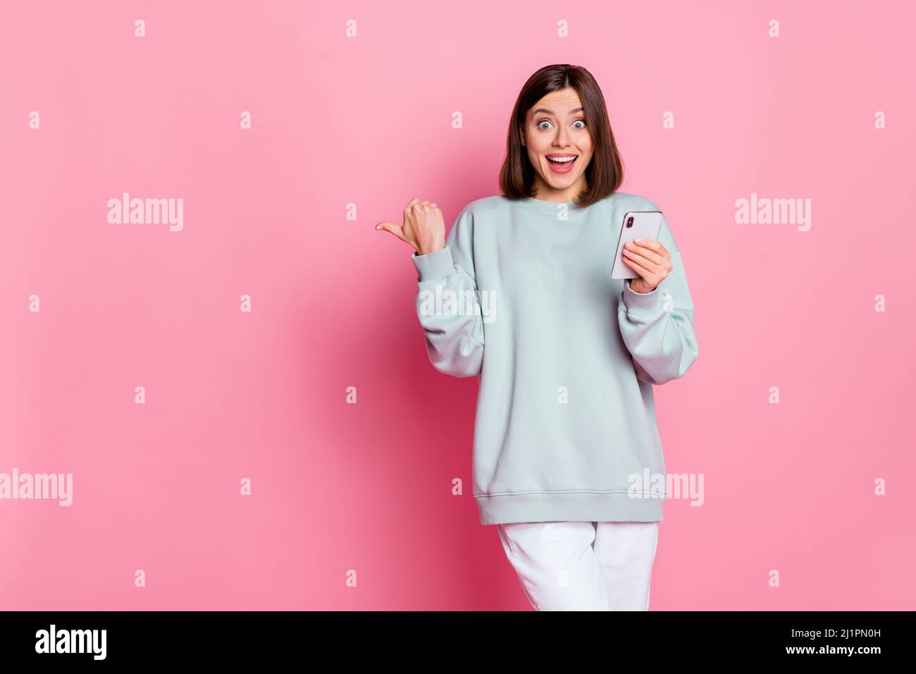 Photo of impressed bob hairstyle young lady hold telephone index promo ...