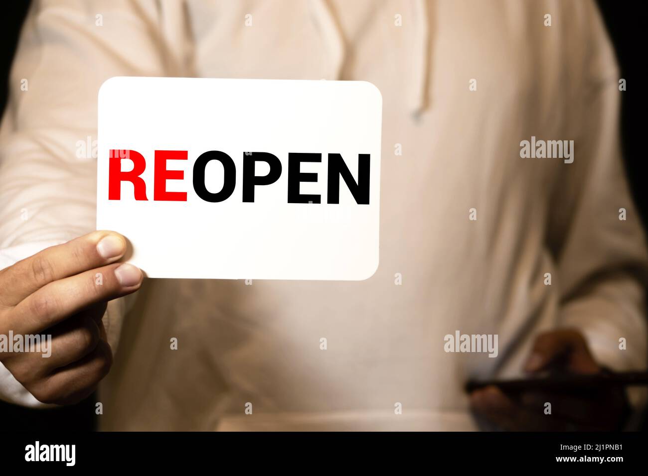 Reopening concept after the coronavirus pandemic. REOPEN word on a ...