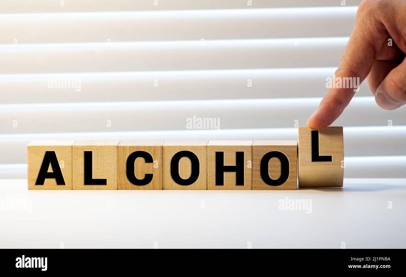 alcohol word written on wood block. alcohol text on table, concept ...