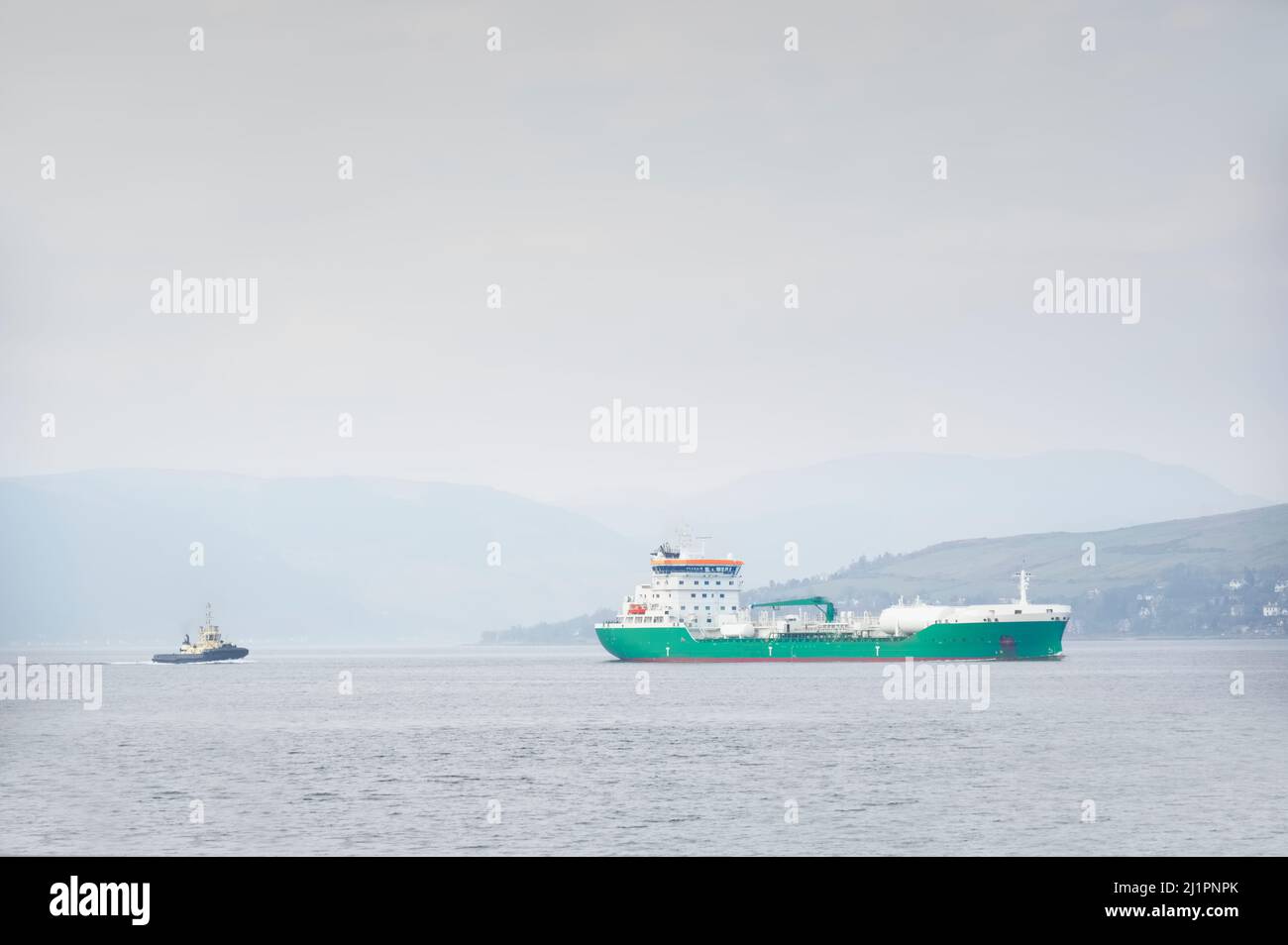 Ship transporting floating storage container platform in sea followed ...