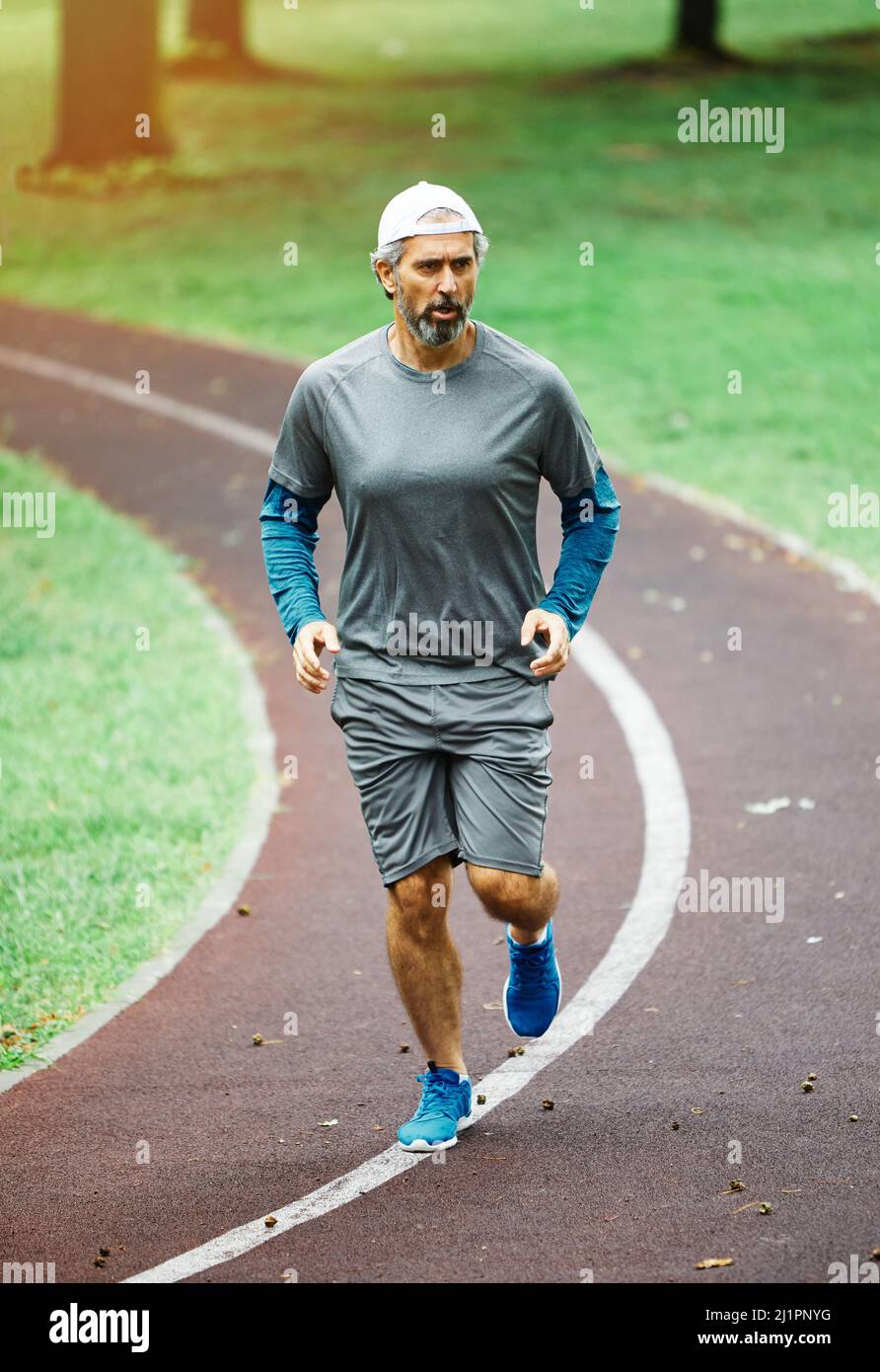 senior man running exercising sport fitness active fit Stock Photo - Alamy
