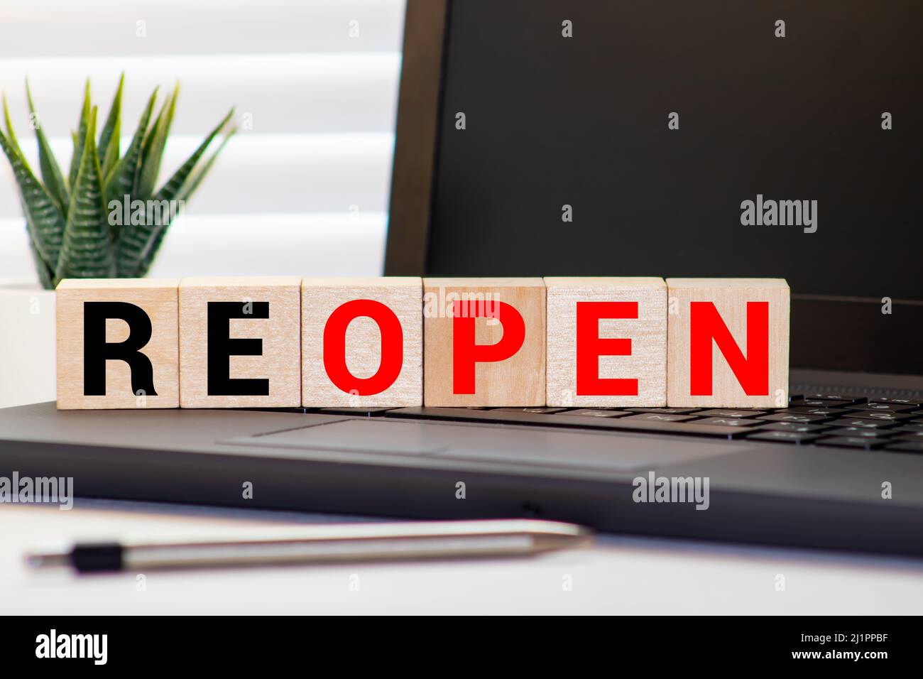 Wooden blocks with REOPEN word, business reopening plan post covid-19 ...
