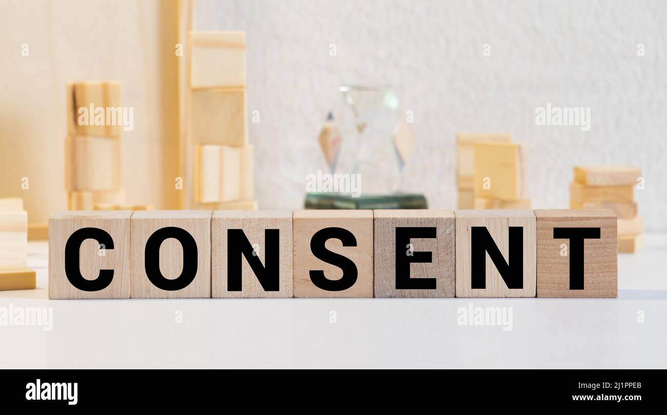 Consent word from wooden blocks on desk Stock Photo - Alamy