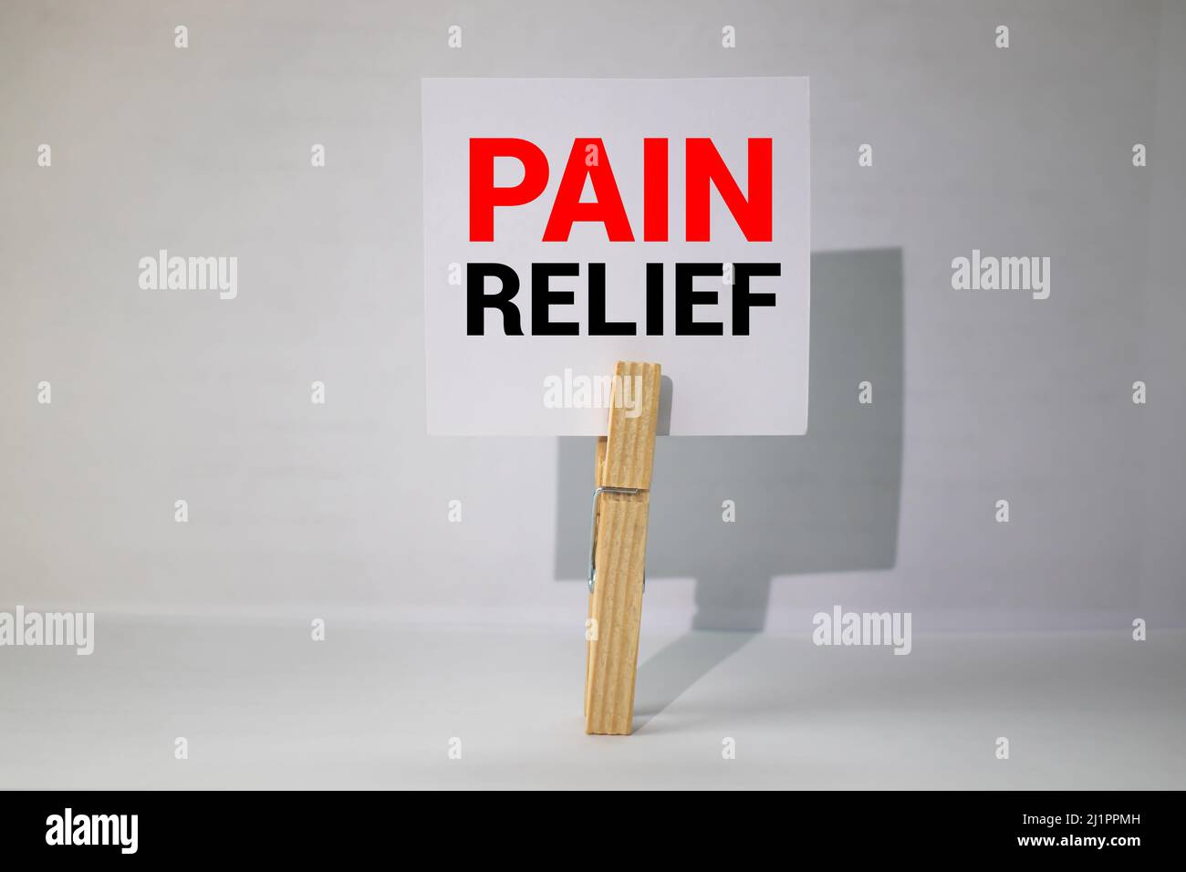 Pain Relief card in hands of Medical Doctor, concept Stock Photo - Alamy