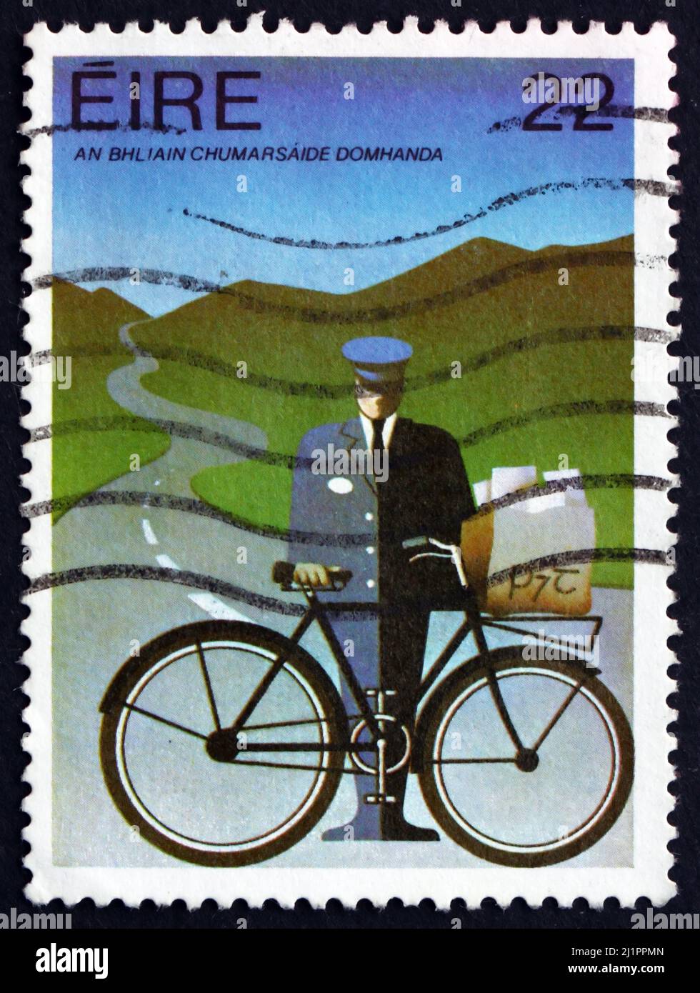 IRELAND - CIRCA 1983: A stamp printed in Ireland shows Mailman, circa ...