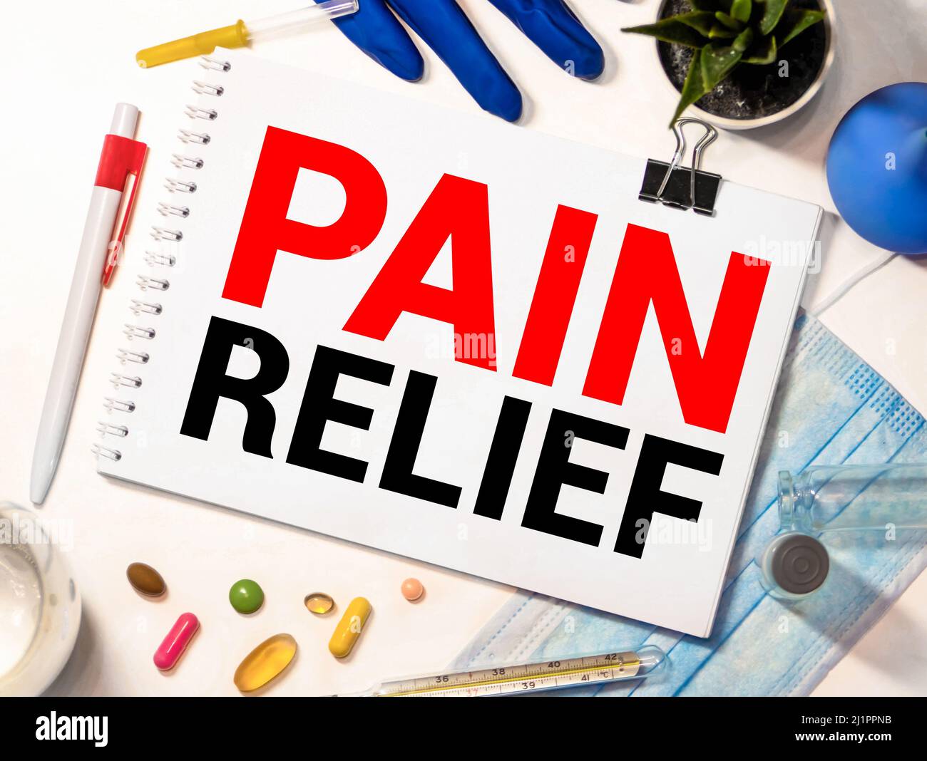 Pain Relief card in hands of Medical Doctor Stock Photo - Alamy