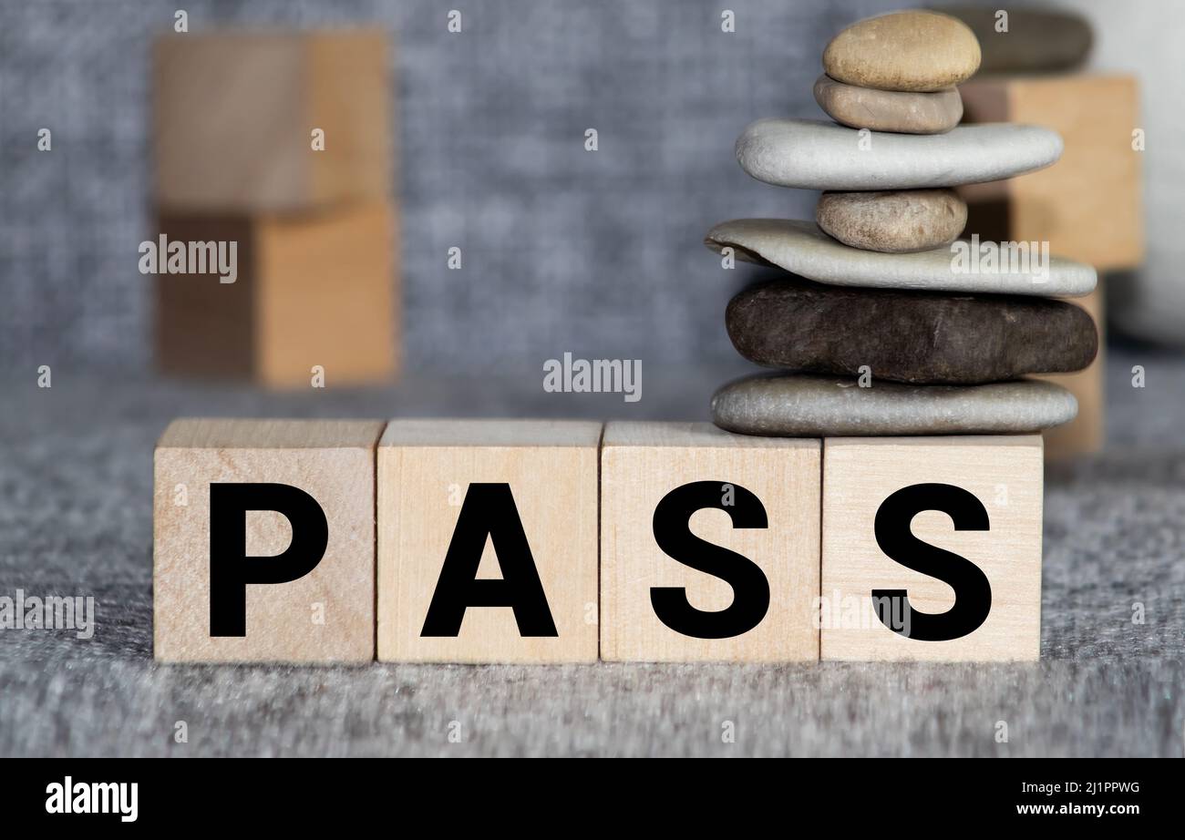 Letter block in word pass on wood background Stock Photo - Alamy