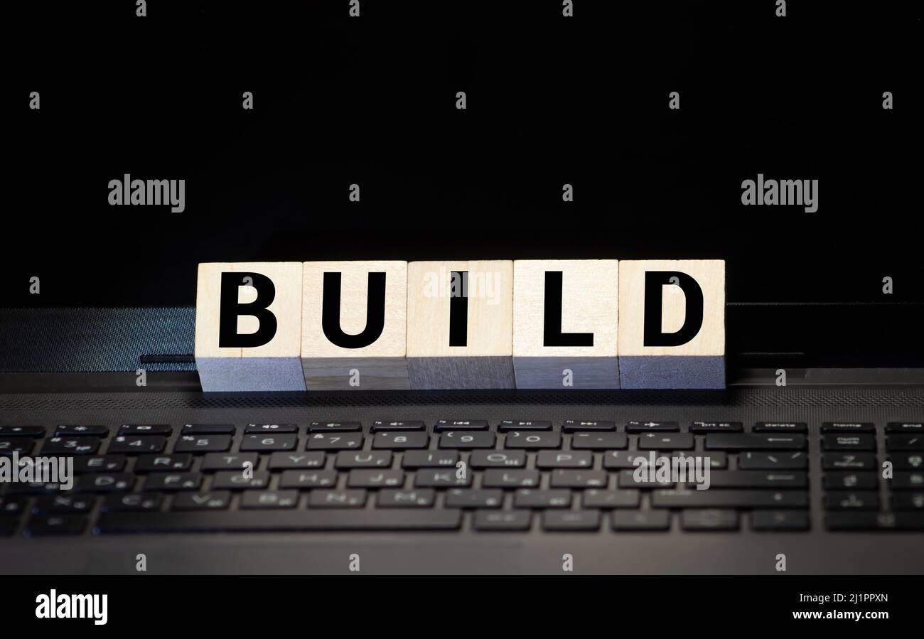Man made word build with wood blocks Stock Photo - Alamy