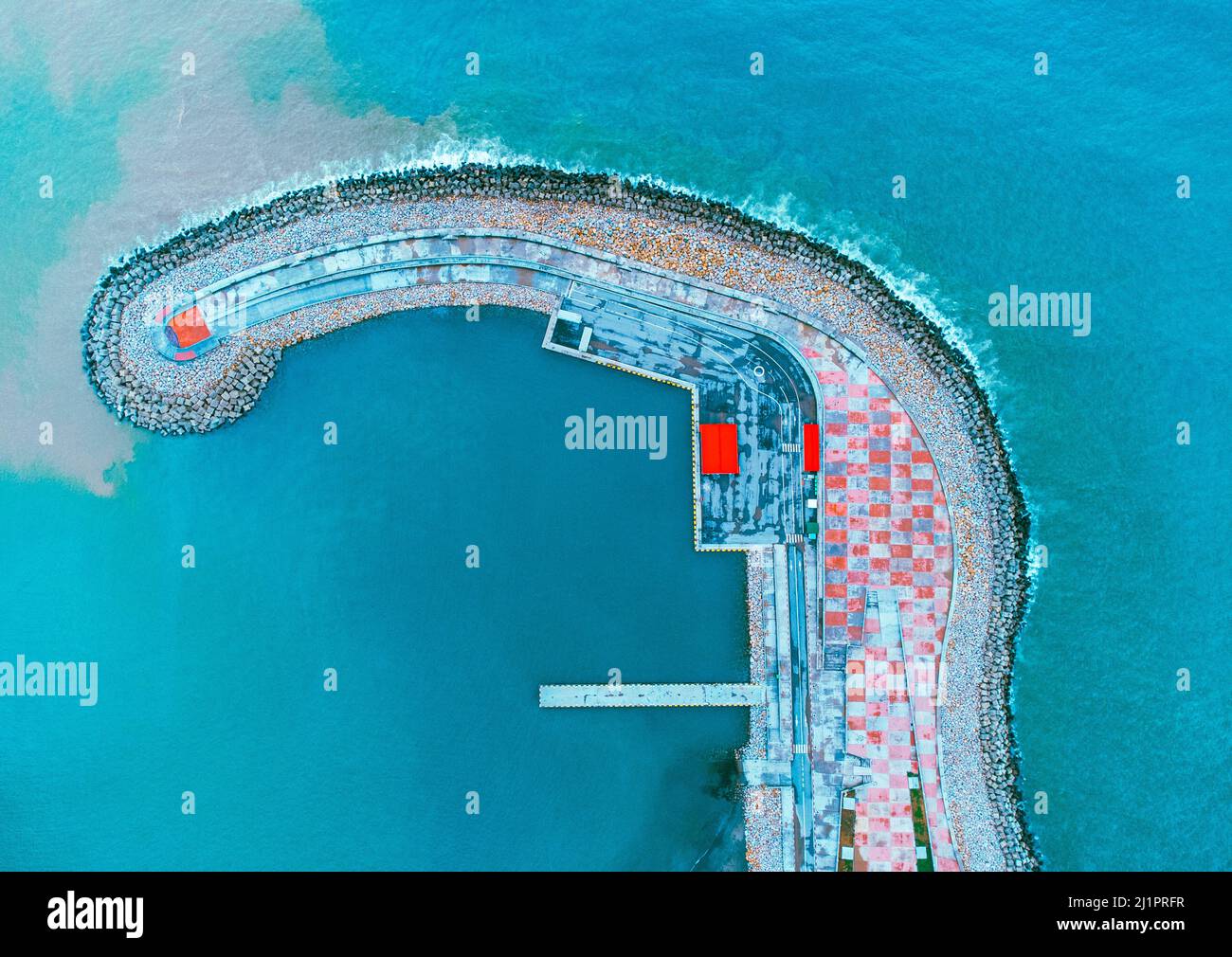 A bird's eye view of a port in the middle of a blue sea Stock Photo - Alamy
