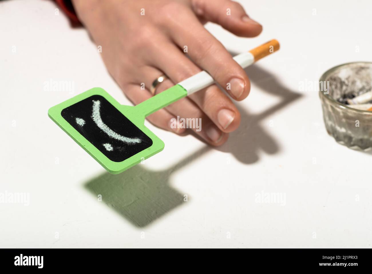 Hand smoking hi-res stock photography and images - Alamy