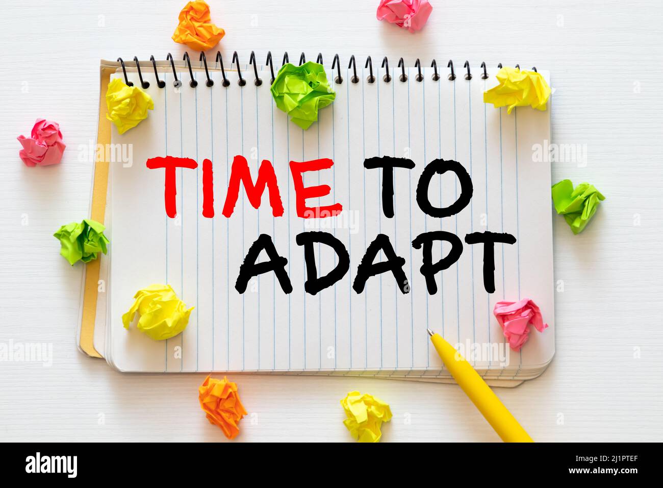 The words 'time to adapt' appearing behind torn black paper. Beautiful ...